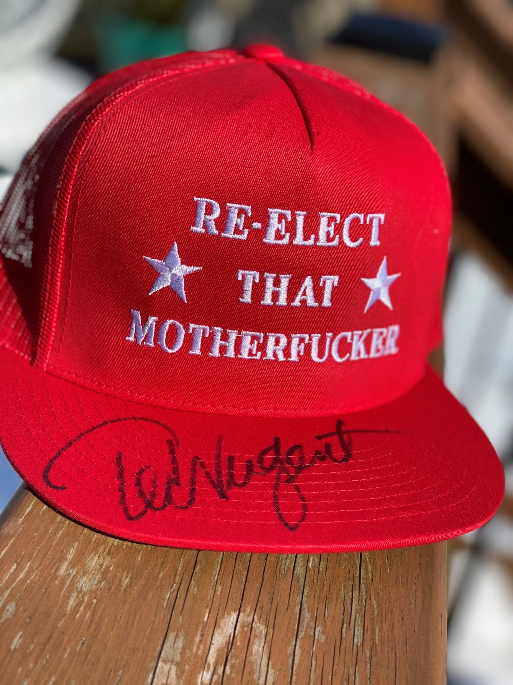 SIGNED “RE-ELECT THAT MF’ER” HATS NOW AVAILABLE!